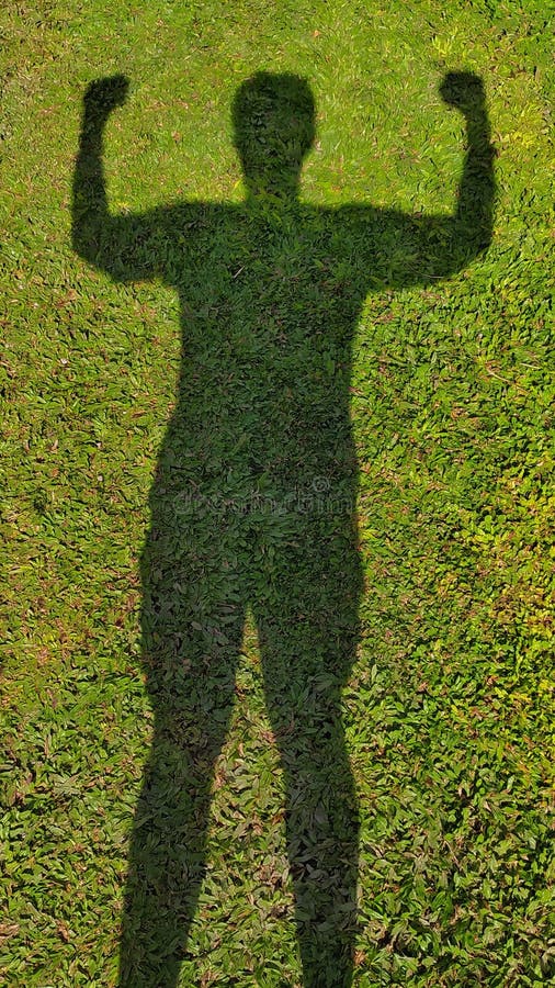 Shadow of a Strong Man in the Grass Stock Photo - Image of green, grass ...