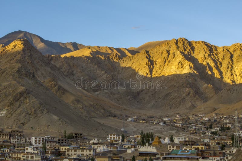 A Shadow From Sunset On The Mountain Above The City Stock Photo - Image ...