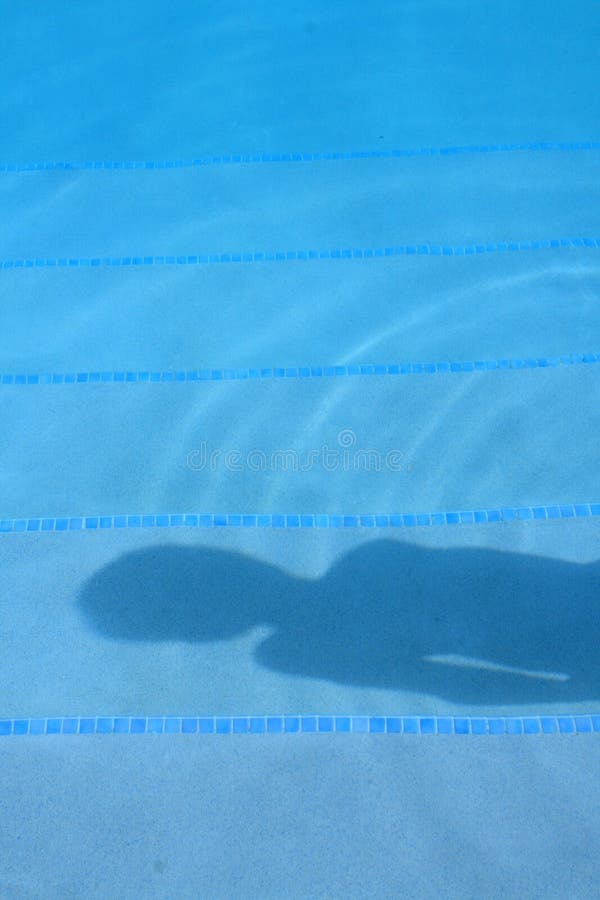 Shadow on a swimming pool stock photo. Image of vertical - 42784798
