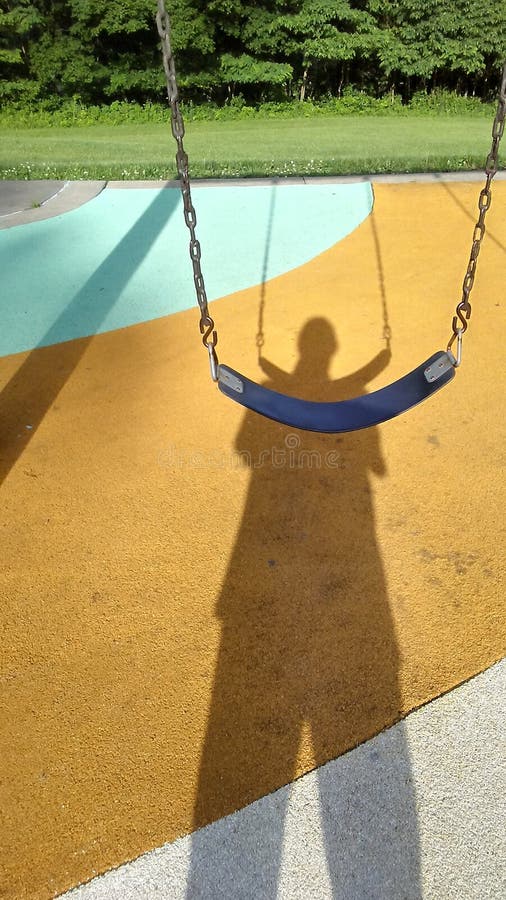 Shadow with swing stock photo. Image of orange, park - 118081290