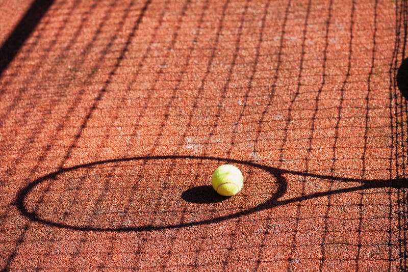 Shadow of a Tennis Racket and Ball on Court Stock Photo - Image of felt ...
