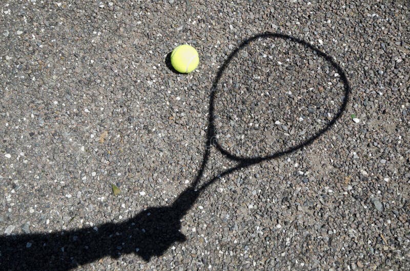 Shadow of a Tennis Racket on a Gravel Ground and a Tennis Ball Stock ...
