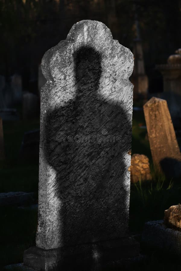 Shadow on tombstone. stock photo. Image of scotia, graveyard - 218469564
