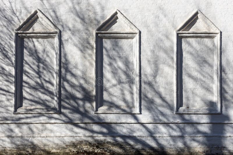 The Shadow of the Tree on the Wall of the House with Windows Stock ...