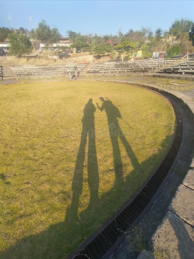 The Shadow of Two People in the Park Stock Photo - Image of tree, grass ...