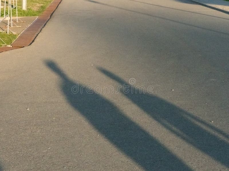 Shadow of Two People on the Road in the Evening Stock Photo - Image of ...