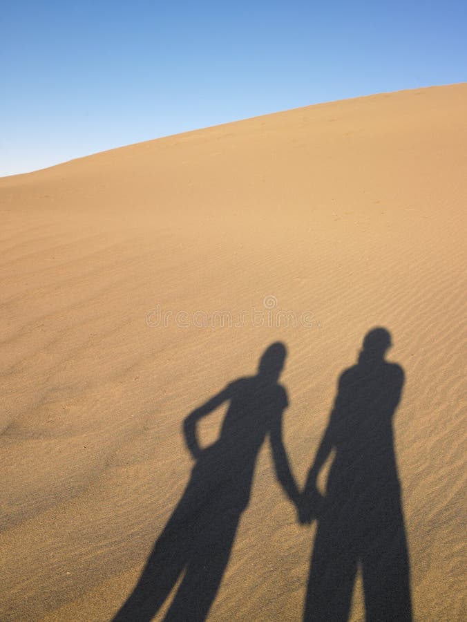 Shadow of Two People on Sand Dune Stock Image - Image of three ...