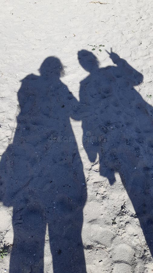 Shadow from Two People. Silhouette of a Two Men Casting a Long Shadow ...