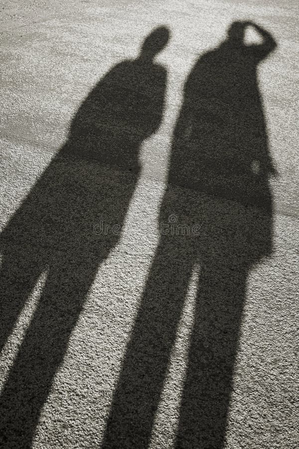Shadow of two people stock image. Image of persons, sunset - 112313271