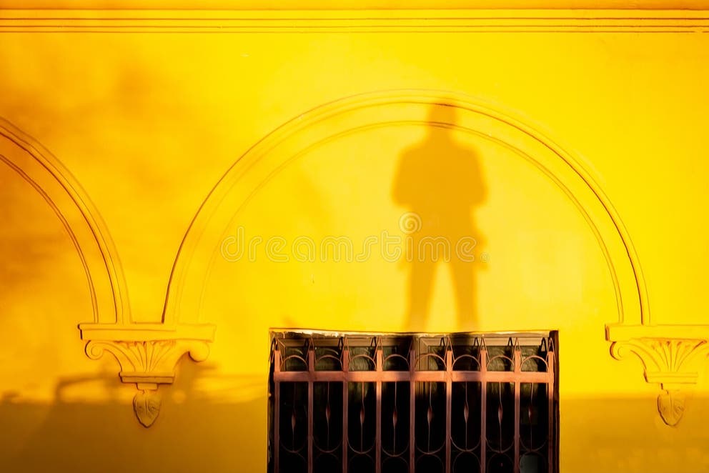 Shadow of an Unknown Man on the Yellow Wall Stock Photo - Image of ...