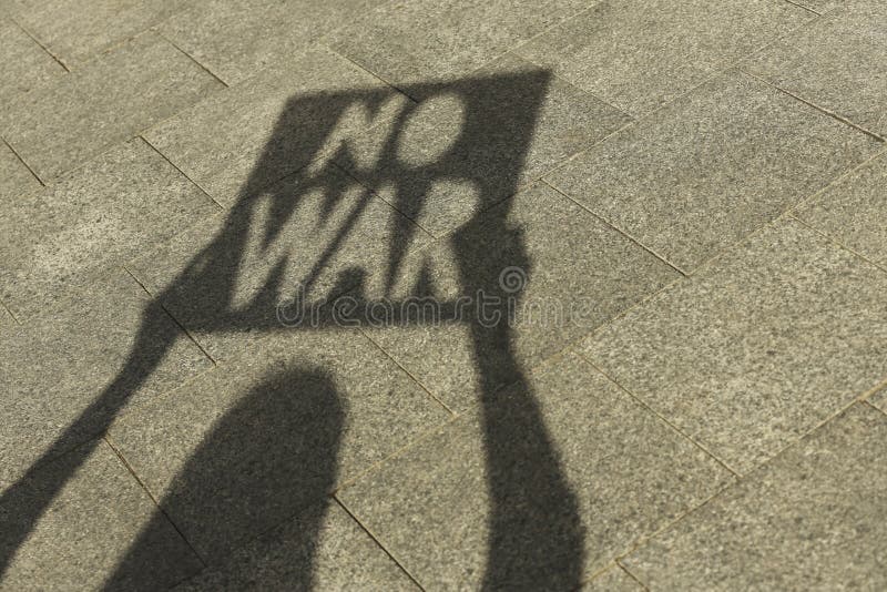 Shadow of Woman Holding Poster with Words No War Outdoors Stock Photo ...