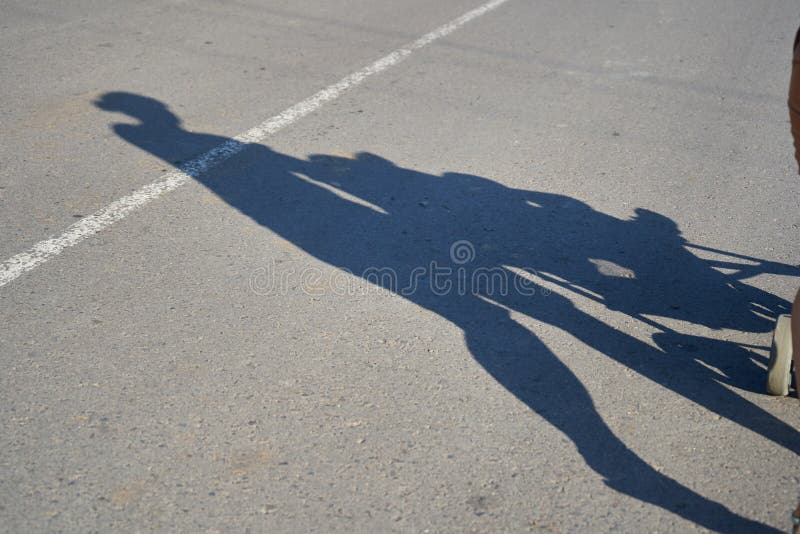 Shadow Woman with a Stroller,silhouette on the Road of a Woman Pushing ...