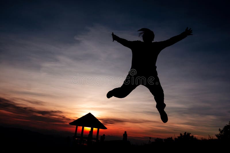 Shadow of Women Jumping at the Top of the Mountain during Sunset Stock ...