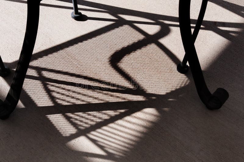 Shadow of a Wrought Iron Chair Stock Image - Image of detail ...
