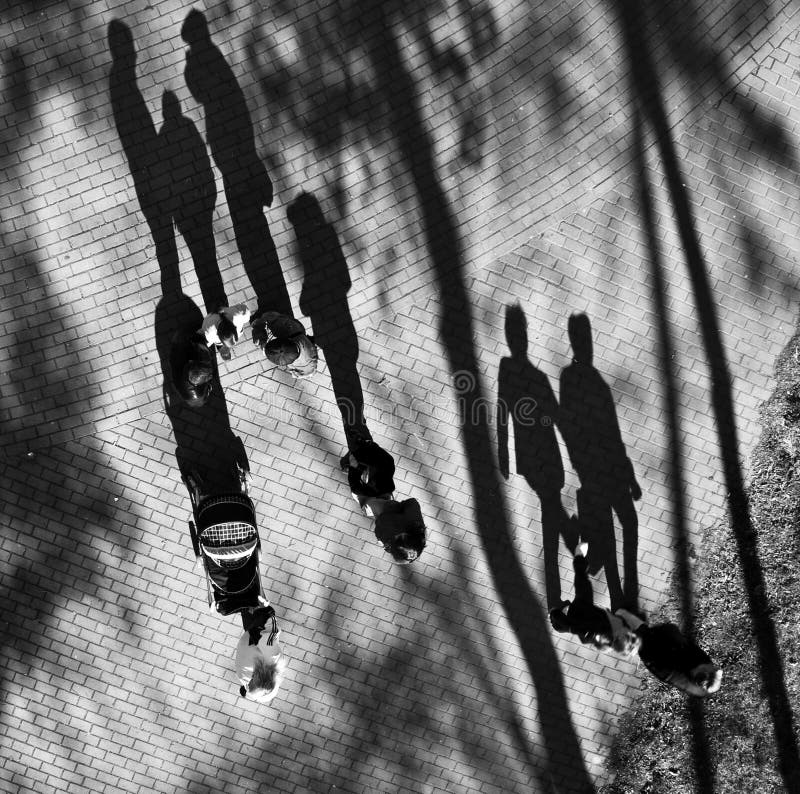 Three shadows stock image. Image of people, street, shadows - 12427625
