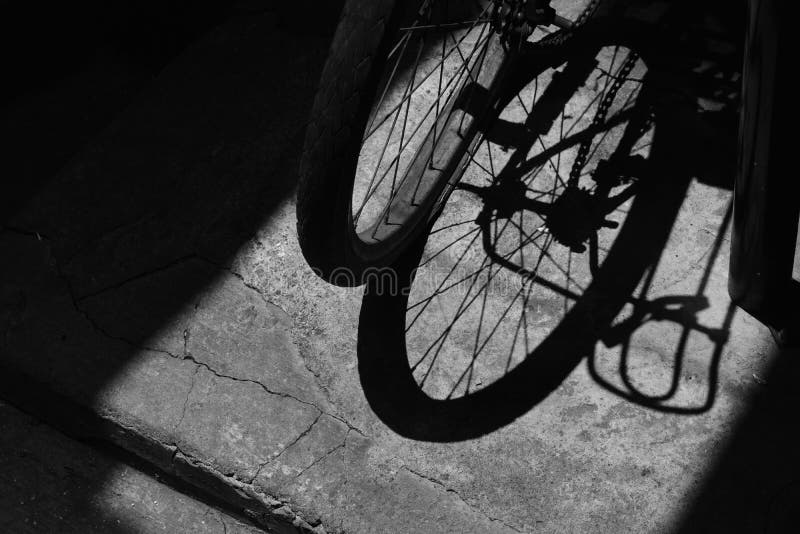 The Shadows of Bicycle Wheel Stock Photo - Image of souls, perspective ...
