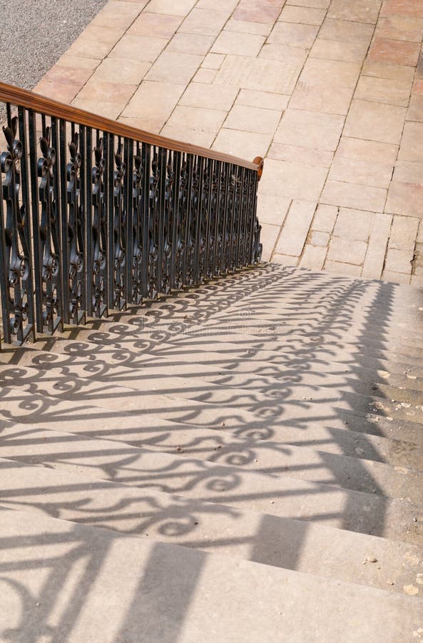 Shadows of Decorative Cast Metal Balusters on Stone Steps Stock Image ...