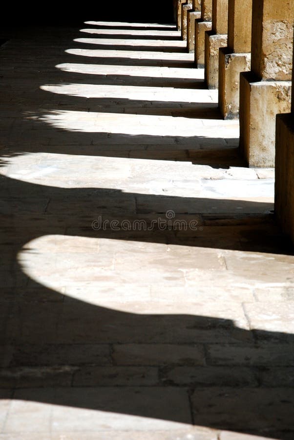 Shadows on the Columns Standing among the Bushes Stock Image - Image of ...