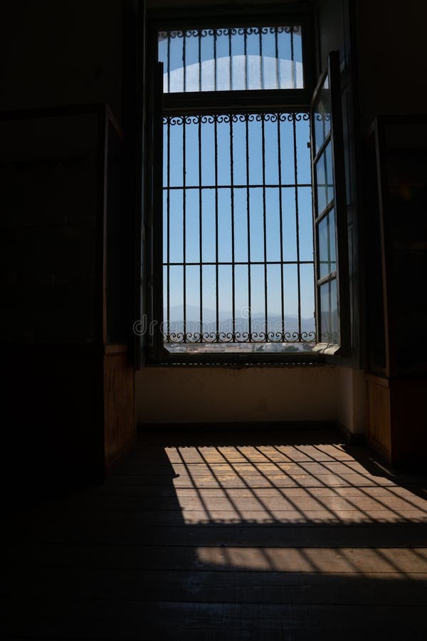 Shadows Formed on Stone Floor from Sun Shing through Security Grill in ...