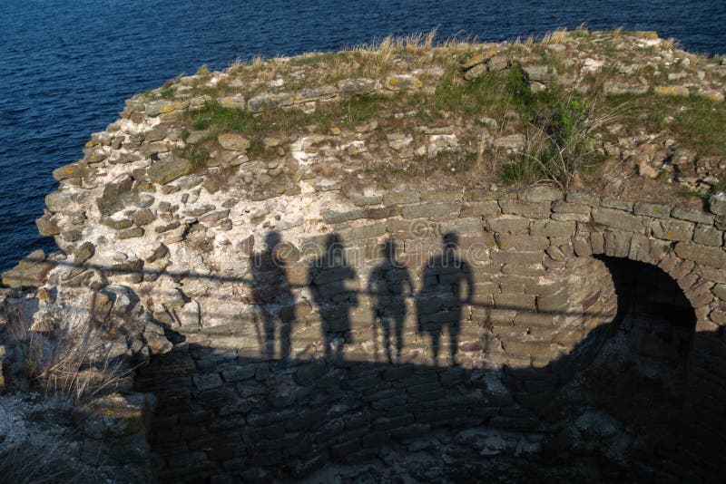 Shadows from Four People on the Wall Stock Photo - Image of sightseeing ...