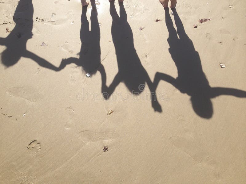 4 shadows stock image. Image of looking, play, beach - 38487805