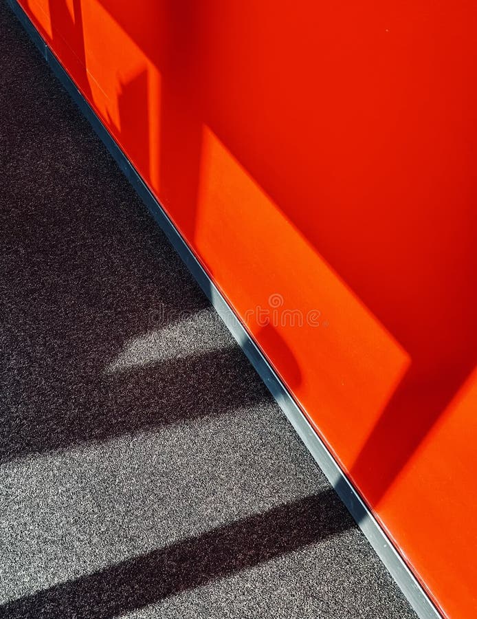 Shadows on Grey Carpet and Red Wall Stock Photo - Image of long, sunny ...