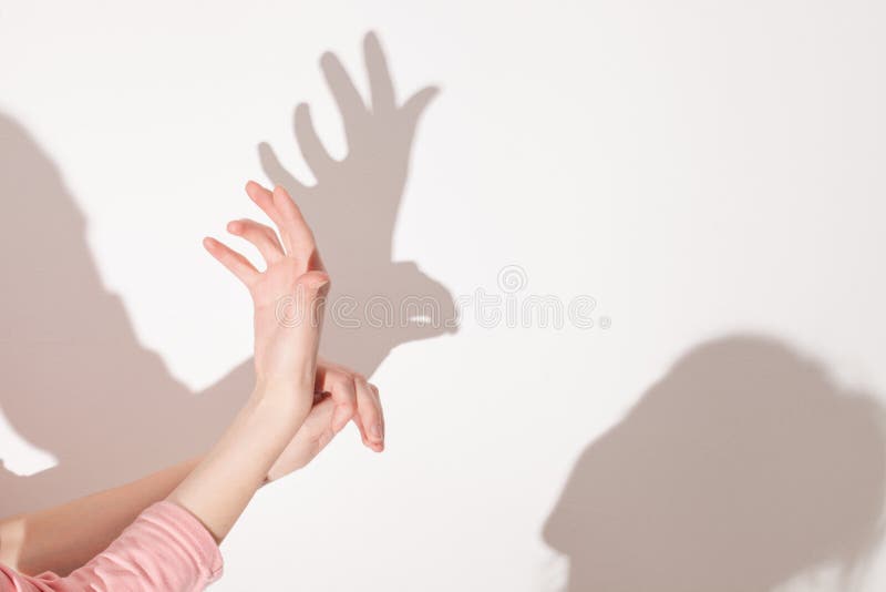 Shadows from the Hand on White Wall Stock Image - Image of people ...