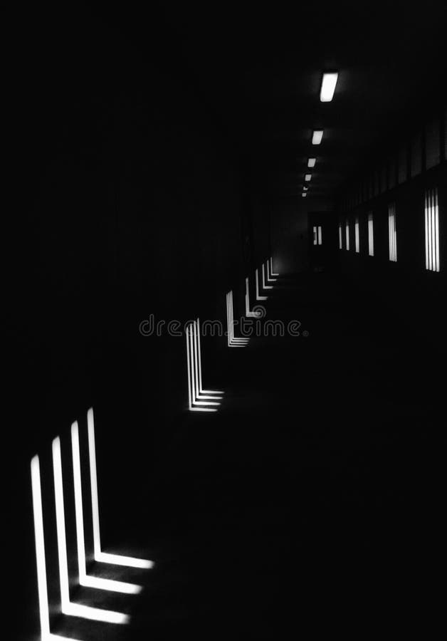 Shadows and Lights Down a Long Corridor Stock Photo - Image of shadow ...
