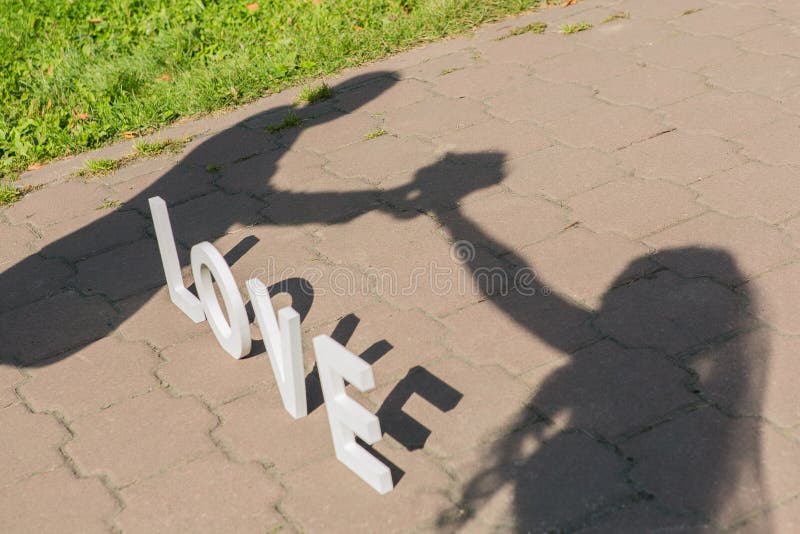 Shadows of love couple stock image. Image of shadow, beach - 54707839