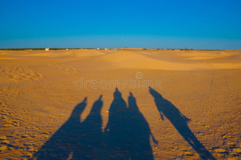 Shadows of 5 Men on the Sand in Sahara Desert in Tunisia Stock Photo ...