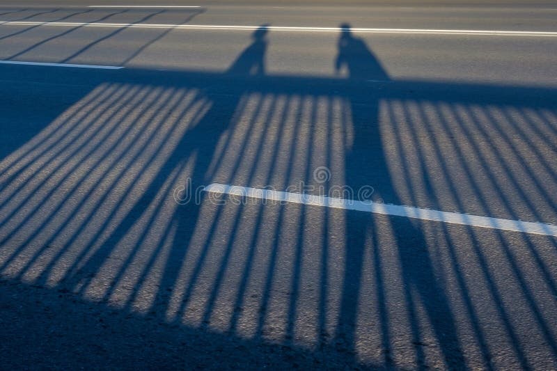 Shadows of Men Walking Outdoors on Road. Stock Image - Image of male ...