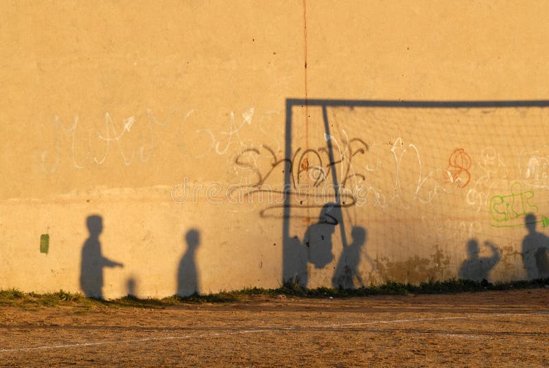 Shadows next to the soccer stock image. Image of young - 23883045