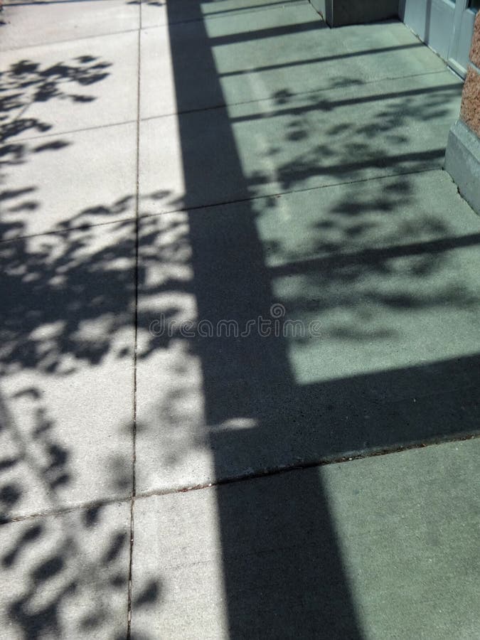 Shadows on a pavement stock image. Image of ground, building - 118886399