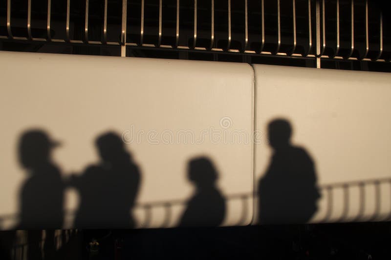 Shadows of People Walking Down a Ramp in the Summer Stock Photo - Image ...