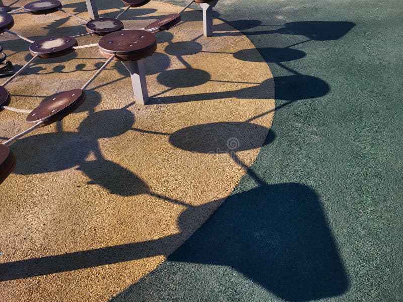 Shadows from the Play Equipment on the Playground. Stock Photo - Image ...