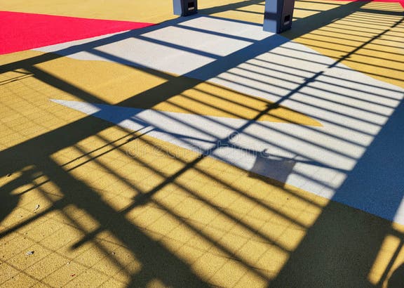 Shadows on the Playground from Fences on a Rubber Surface. Stock Photo ...