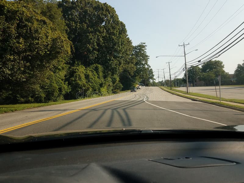 Shadows on Road from Power Lines View from Inside Car Stock Photo ...