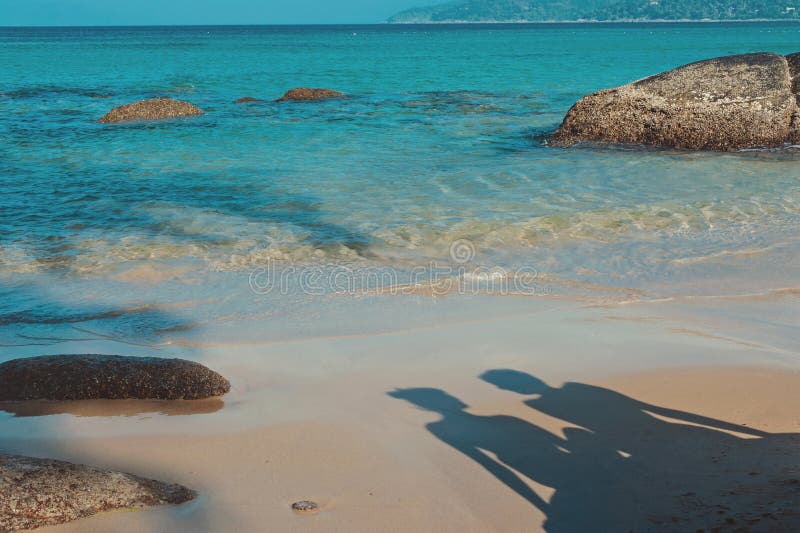 Shadows on the sand stock photo. Image of coastline, silhouette - 36934488