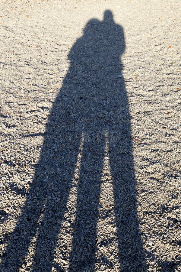 Shadows on the sandy beach stock photo. Image of stone - 38949186