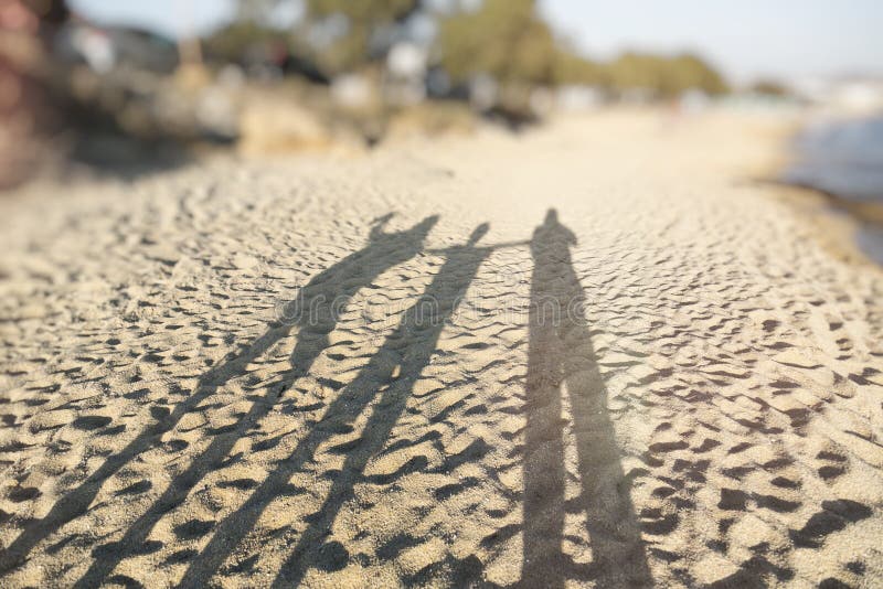 Shadows of Three Generations of Men on White Background Stock Image ...