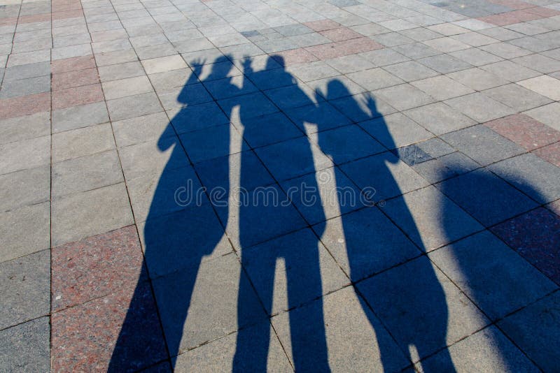 The Shadows of Three People on a Pavement Tiles Stock Photo - Image of ...