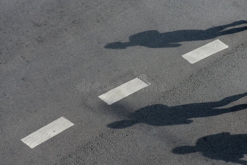 Shadows of Three Runners on the Road Stock Photo - Image of visible ...