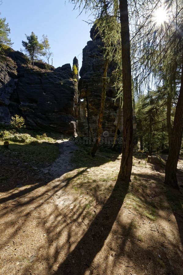 Shadows of Trees on the Path Leading To Tall Cliffs Stock Photo - Image ...