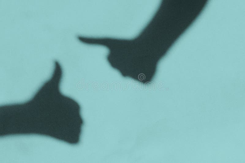Shadows of Two Hands with Thumb Up Sign Shape on Green Background ...