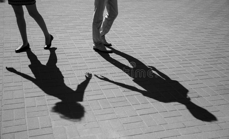 Shadows of Two Young People Stock Image - Image of emotion, legs: 70195905