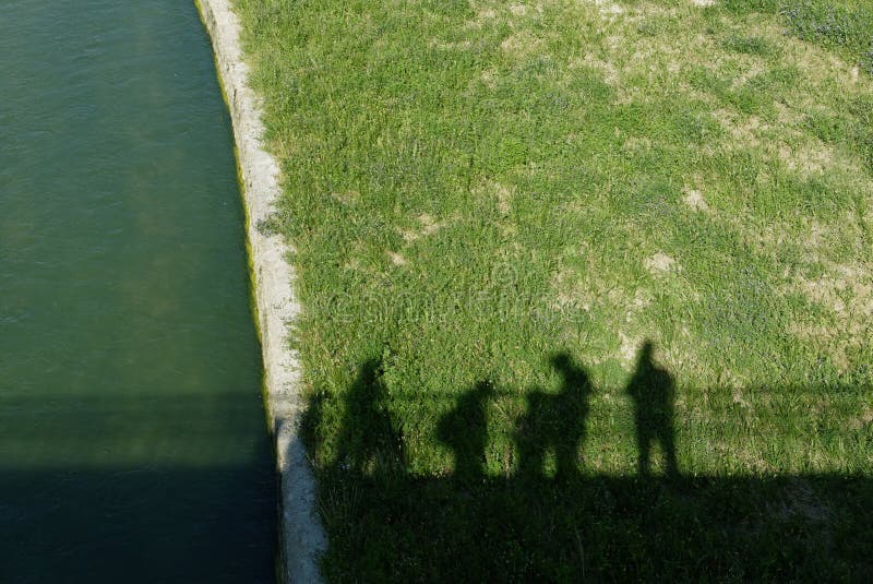 Shadows that Walk on the Riverbank Stock Image - Image of path, shadow ...