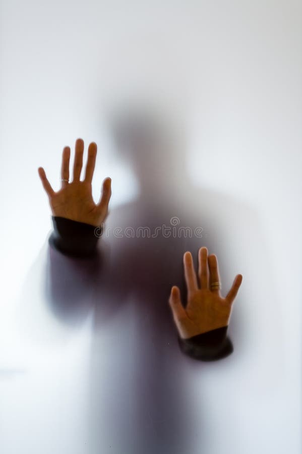 Shadowy Human Figure Behind a Frosted Glass Stock Photo - Image of ...