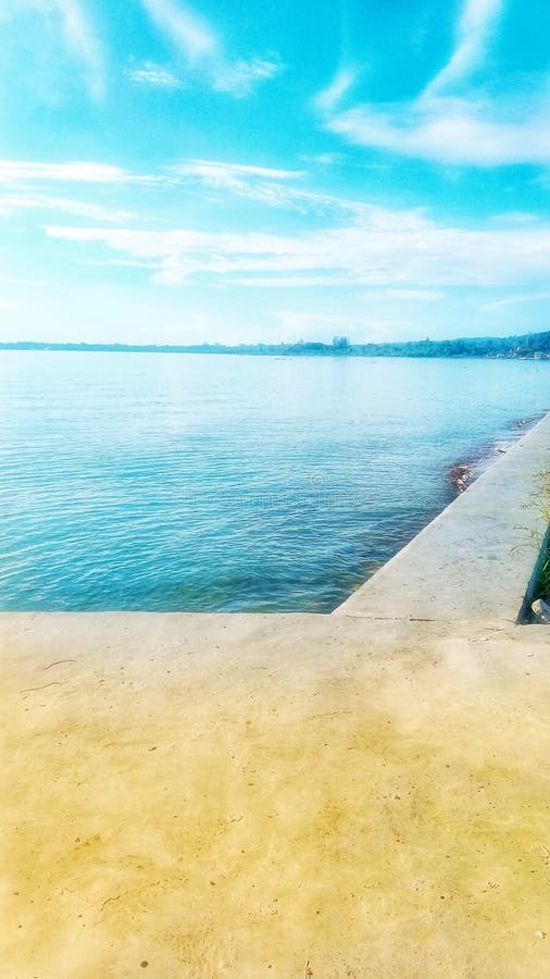 Shady Water at the Edge of the Beach and Clear Skies in the Morning ...