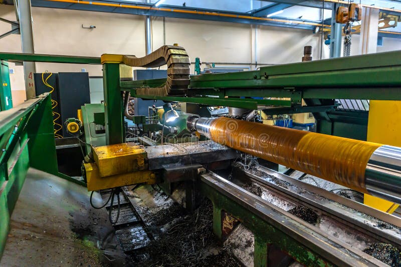 The Big Shaft is Made on a Huge Lathe in the Workshop Stock Photo ...
