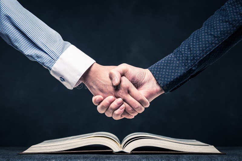 Shake hands on open books stock image. Image of estate - 94285819